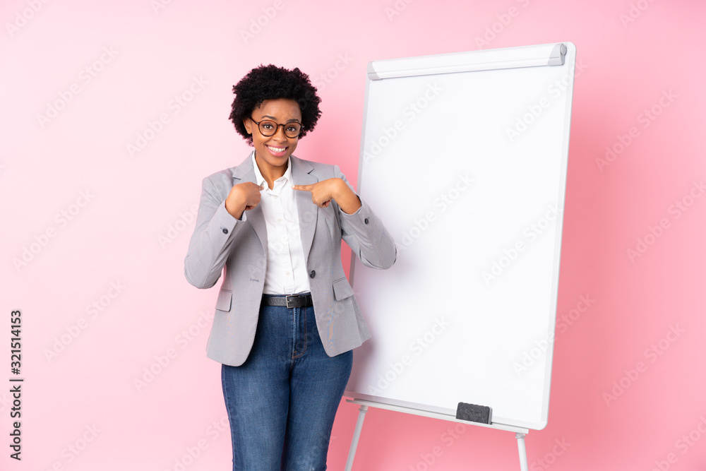 African american business woman giving a presentation on white board ...