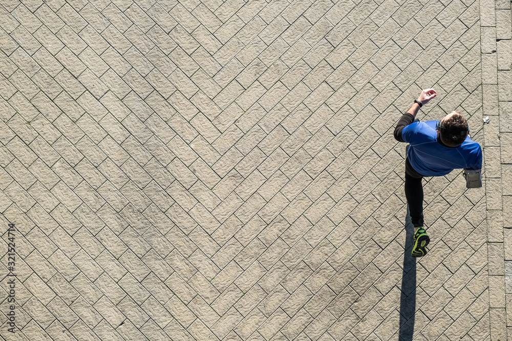 view from above of a young man running over a steel mill Stock Photo ...