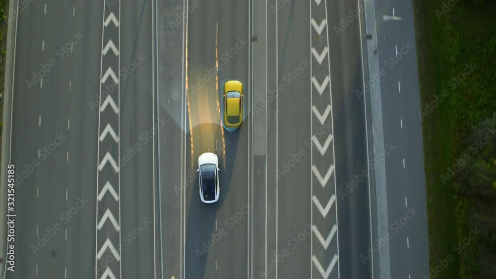 Aerial Top Down View: Autonomous Self Driving Car Moving Through City ...