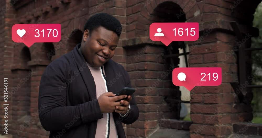Fat man using smartphone and smiling while walking at city street ...