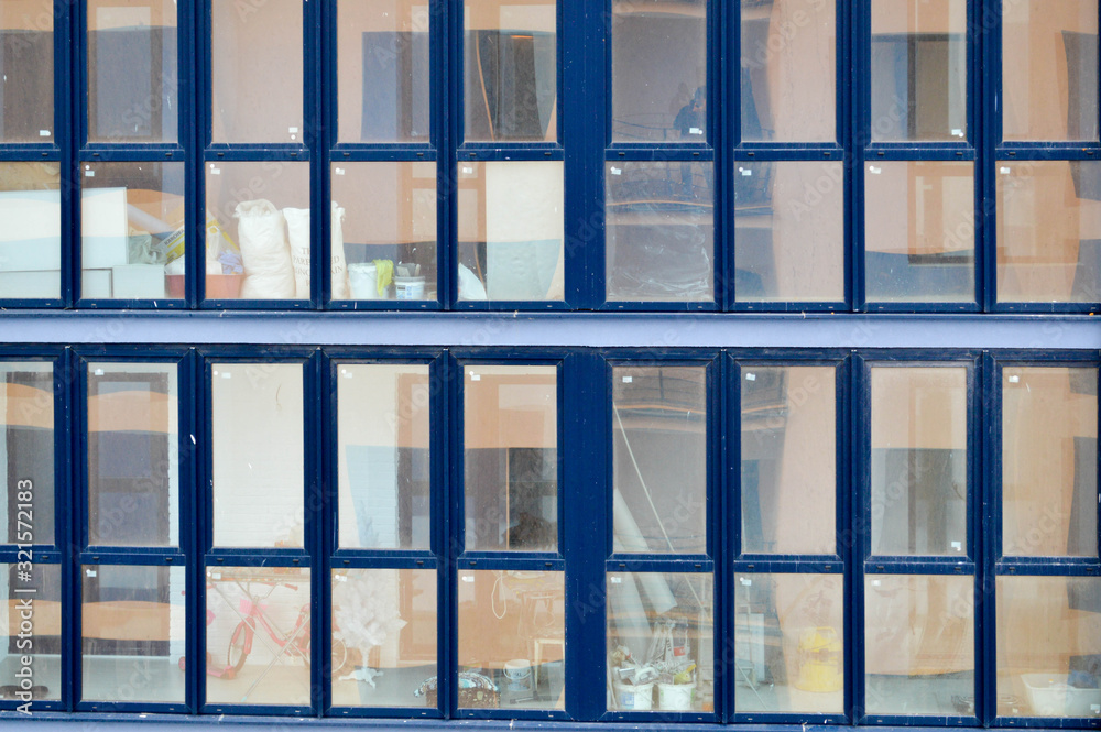 Beautiful modern blue glass fiberglass windows of the facade wall of a ...