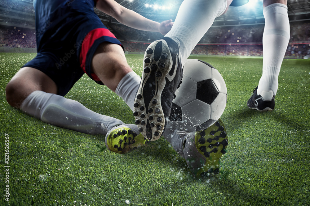 Football scene with competing football players at the stadium Stock ...