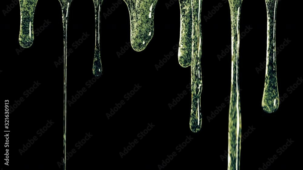 Colored mucus flowing from top to bottom on the dark background vídeo ...