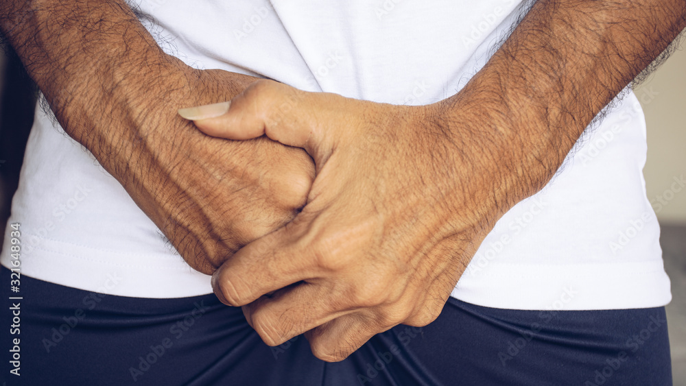 Close up of a man with hands holding his crotch, Urinary Tract ...