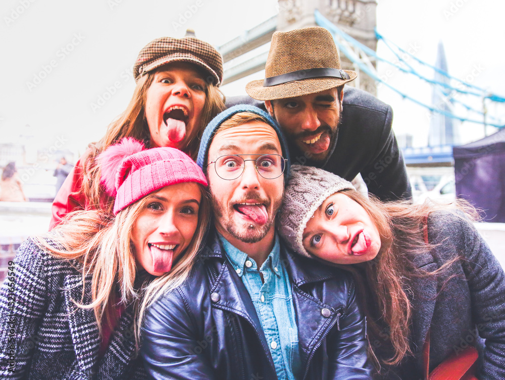 Multicultural best friends millenials taking selfie with back lighting ...