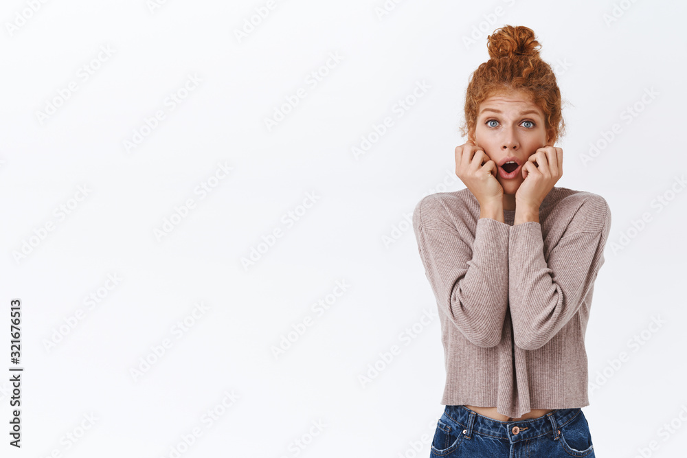 Scared, troubled shocked redhead caucasian woman with curly hair in ...