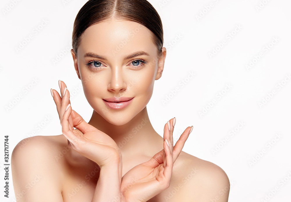 Beautiful young woman with clean fresh skin touching her face . Girl ...