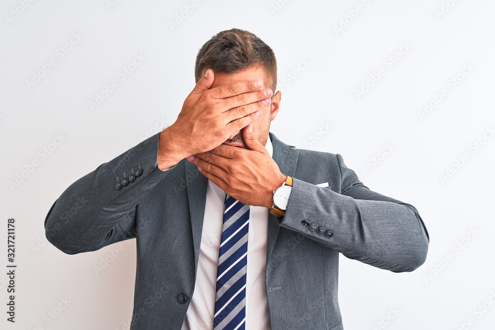 Young handsome business man wearing suit and tie over isolated ...
