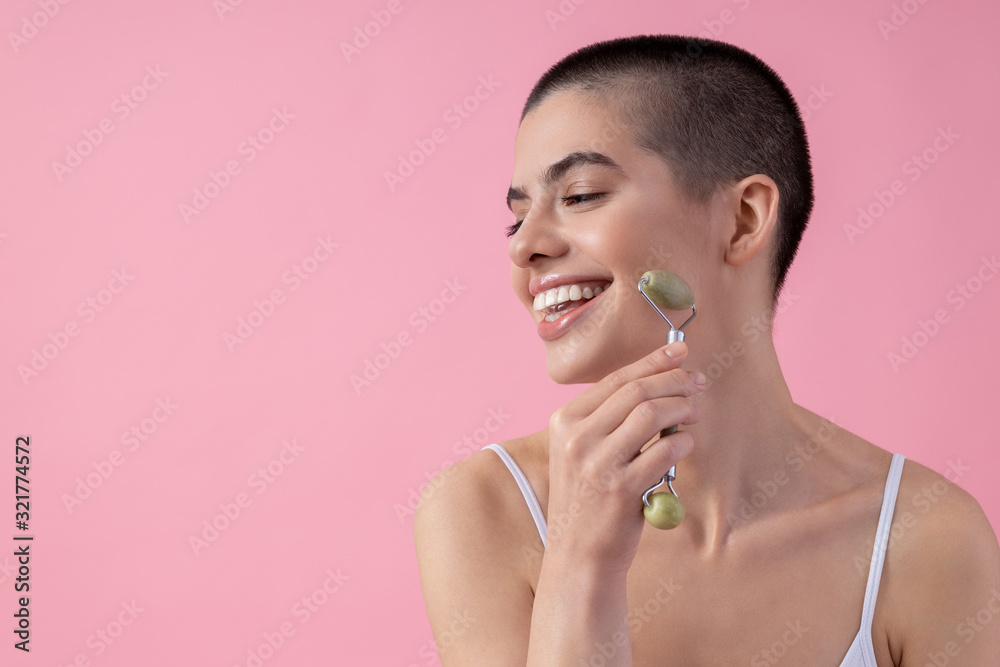 Gladsome lady at massage therapy on the pink background stock photo ...