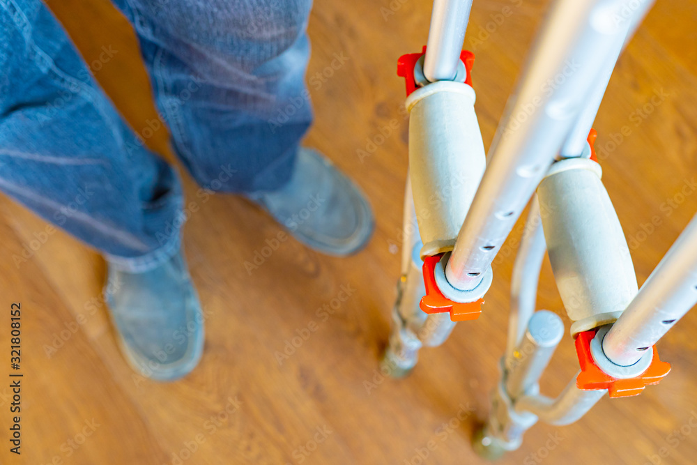 Legs and white crutches. Consultation of the traumatologist. Surgical ...