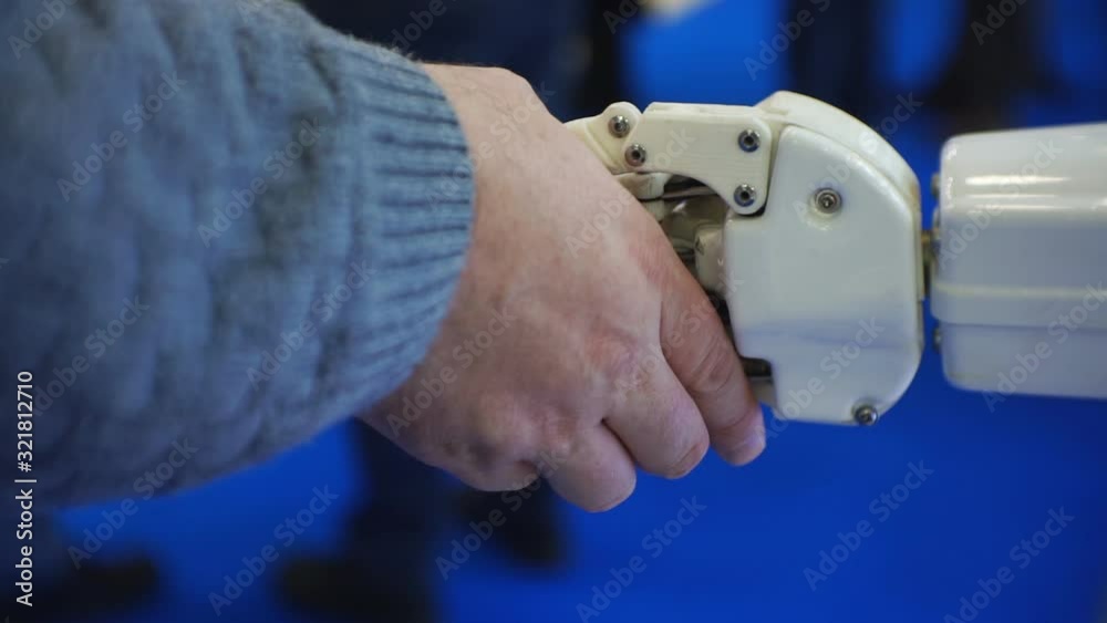 Human handshake with a robot. The concept of human interaction with ...
