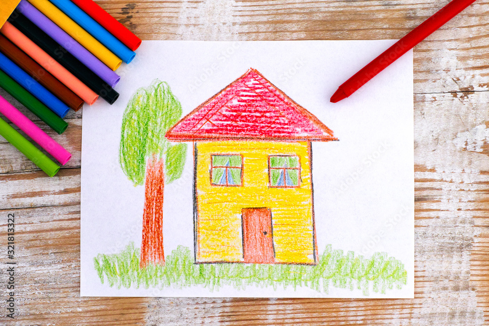 Child hand drawing House with wax crayons. Wooden background. Stock ...