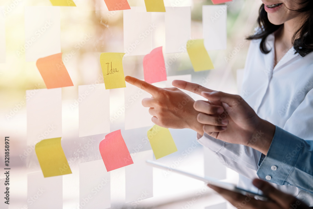 Group of young modern business people planning and brainstorming ...