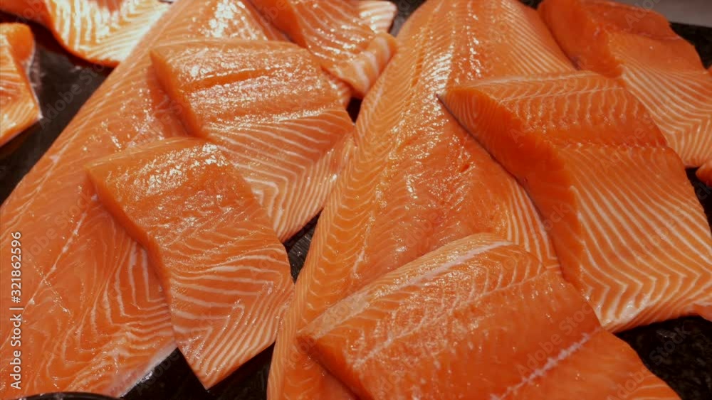 Close Up of Fresh Orange Salmon Fillet on Display on Grocery Store. Red ...