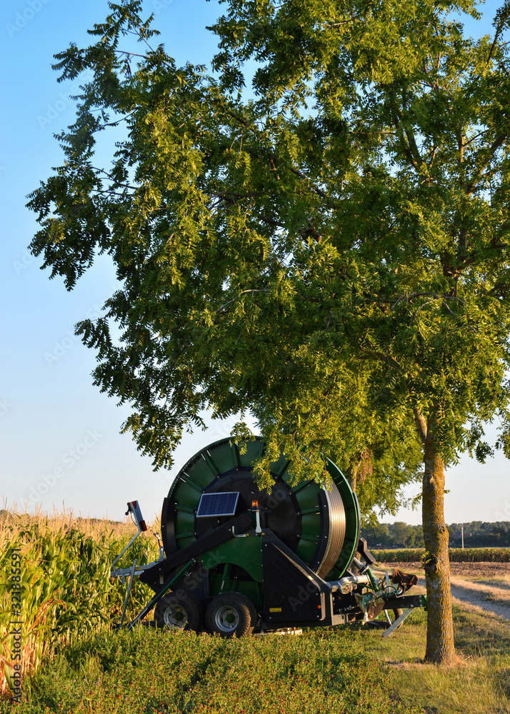 Irrigation system with a big hose reel and photovoltaic solar panel at ...