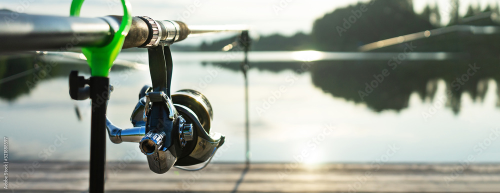 Carp fishing on beautiful blue lake with carp rods and rod pods in the ...