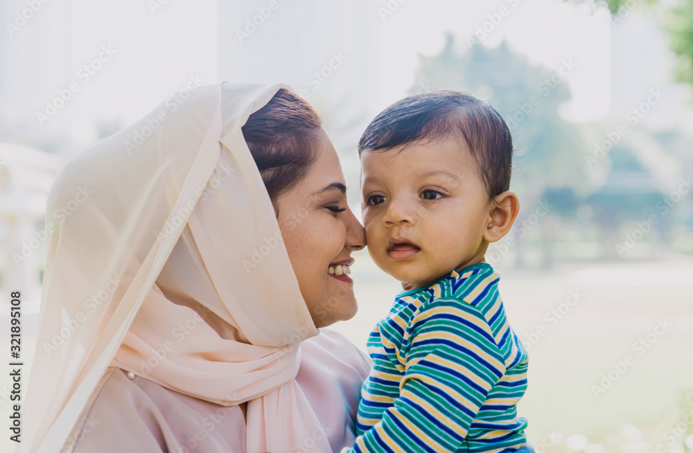 Arabic mom and her little toddler playing outdoors Stock Photo | Adobe ...