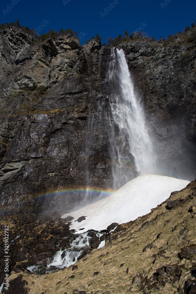 Feigefossen waterfall in norway and a rainbow. With 218 meter of free ...