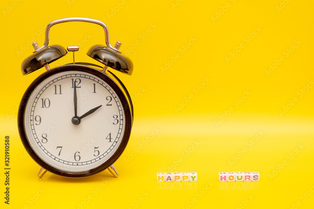 "Happy Hours" is written by cubes with letters with a black and white ...