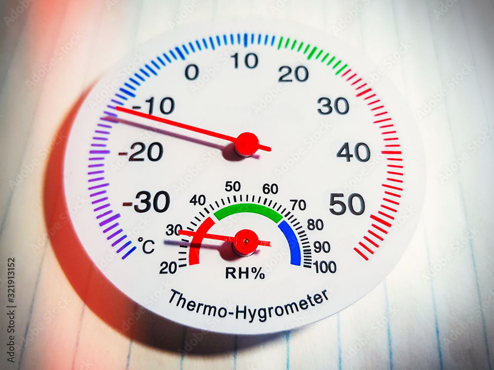 An analog hygrometer with a scale and an arrow for measuring ...