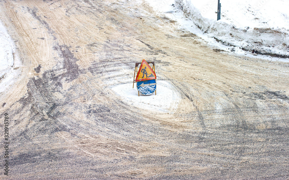 Road signs: repairs and detours. Snow removal in the winter city. An ...