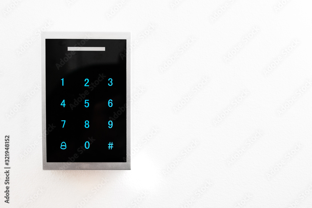 Keypad electronic lock side view. Lock with black glossy front pane and ...