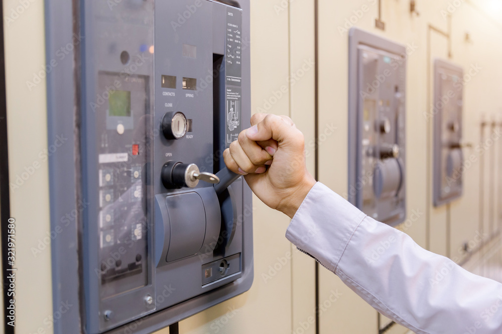 Engineer is check voltage or current by voltmeter in control panel of ...