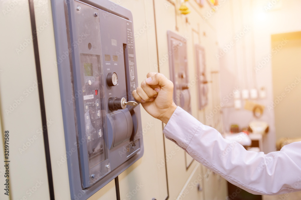 Engineer is check voltage or current by voltmeter in control panel of ...