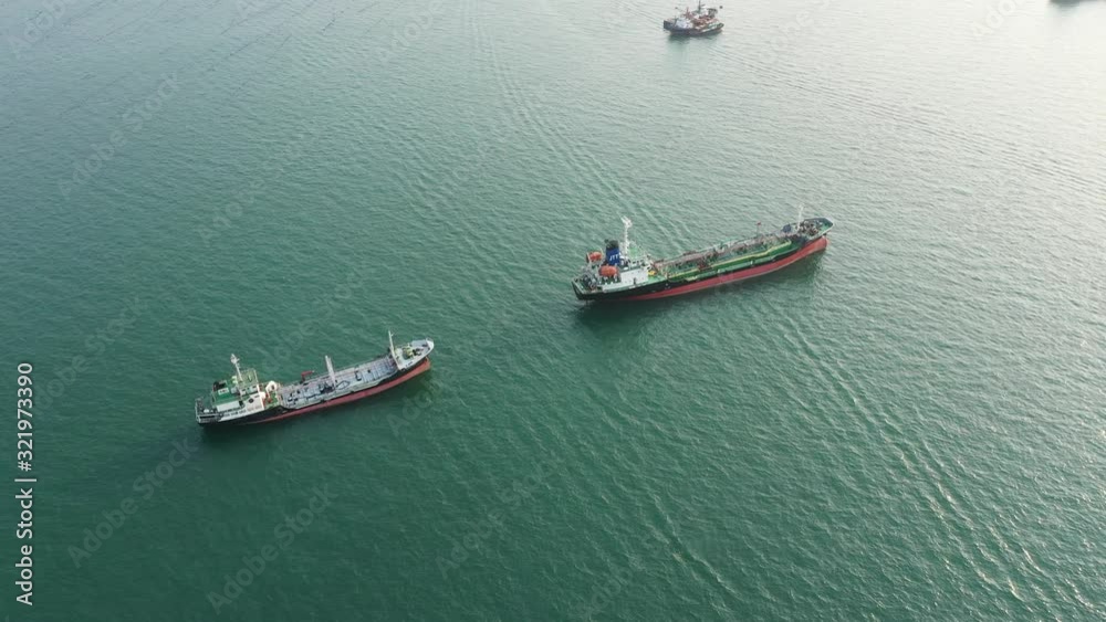 Aerial top view of the ship carrying the lpg and oil tanker in the sea ...