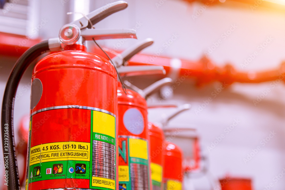 Red tank of fire extinguisher Overview of a powerful industrial fire ...