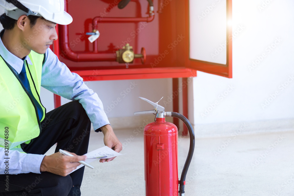 Engineer inspection Fire extinguisher and fire hose.. Stock Photo ...