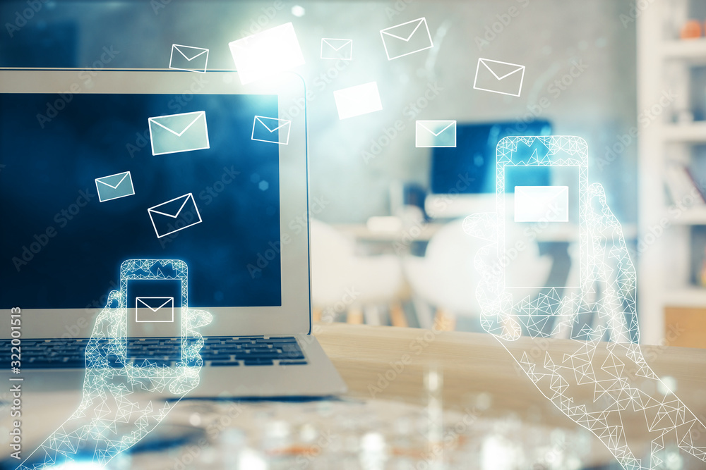 Desktop computer background in office and flying envelops hologram ...