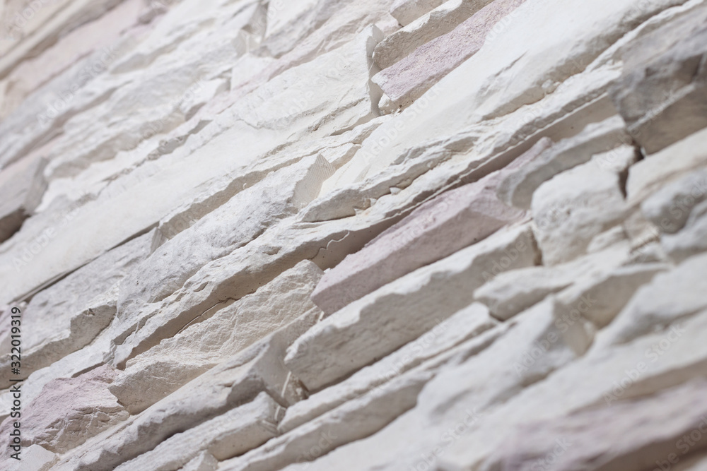 Texture of a stone wall made of white rough-cut stone. Background ...