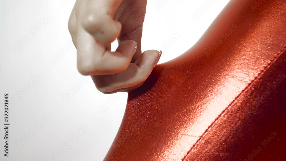 Tracking shot of the hand with manicure of girl in a tight fitting ...