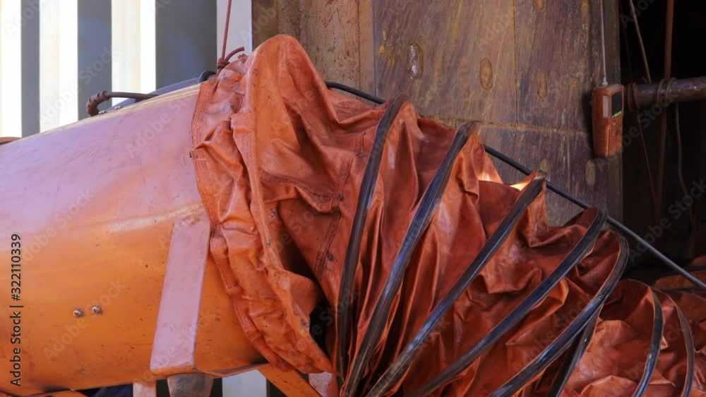 Footage of safety precautions worker using ventilation fan while ...