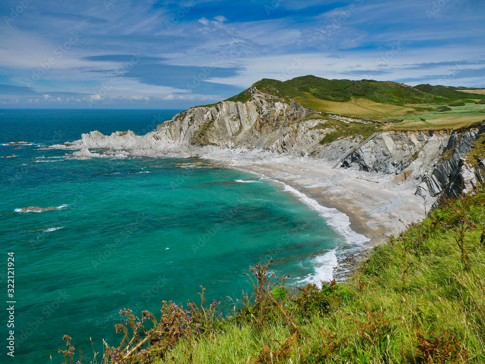 The north Devon coast at Rockham Beach showing steeply inclined slate ...