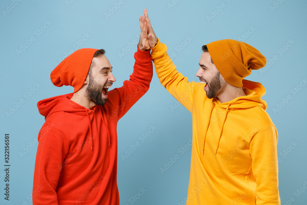 Two funny hipster men guys in fashion red yellow clothes posing ...