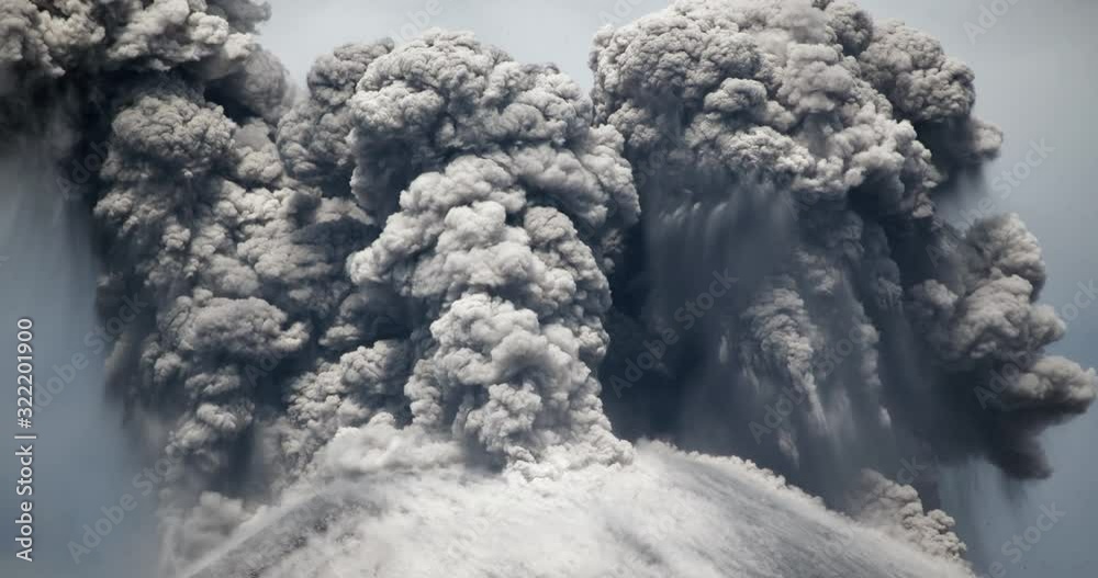 Spectacular volcanic eruption. Huge boulders are thrown from the ash ...