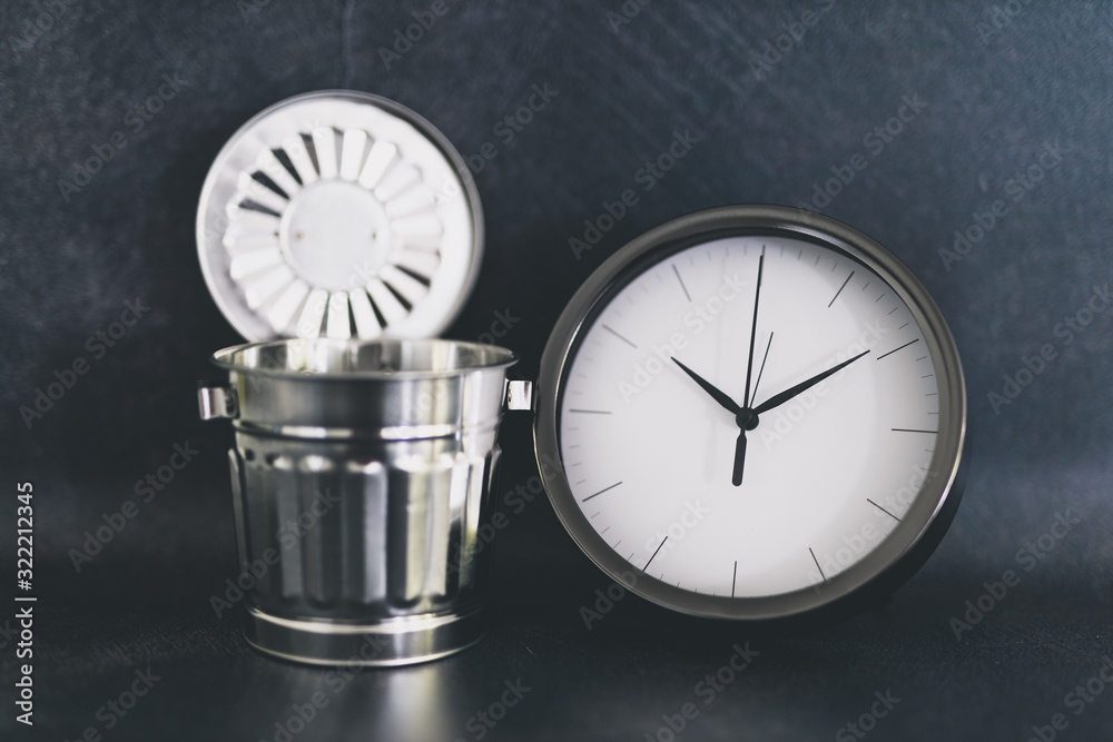 not wasting time, oversize clock with miniature garbage bin on business ...
