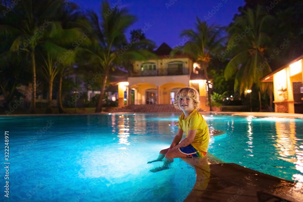 Kids in swimming pool at night Stock Photo | Adobe Stock