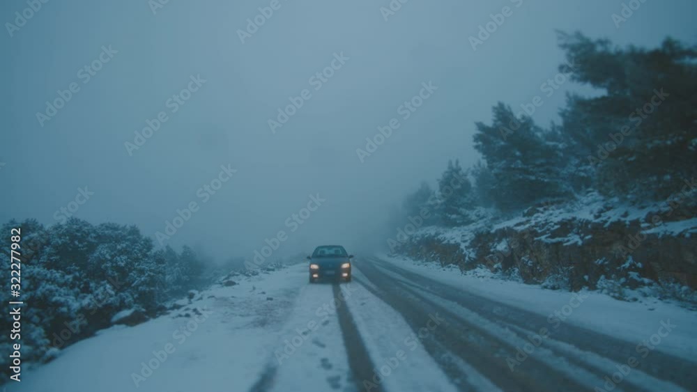Stranded Car car in snow blizzard in foggy Forest mountain Road.Health ...