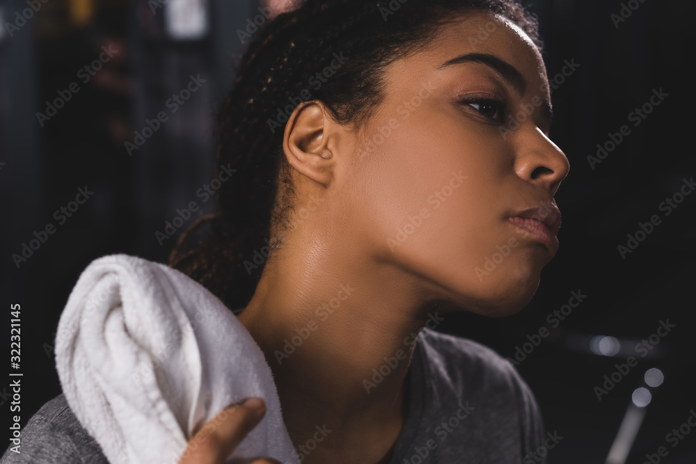 african american girl wiping sweat with towel Stock Photo | Adobe Stock