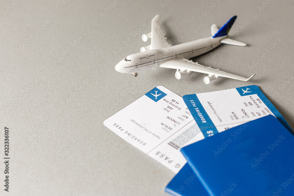 Flight tickets with passports, model of airplane, isolated on white ...