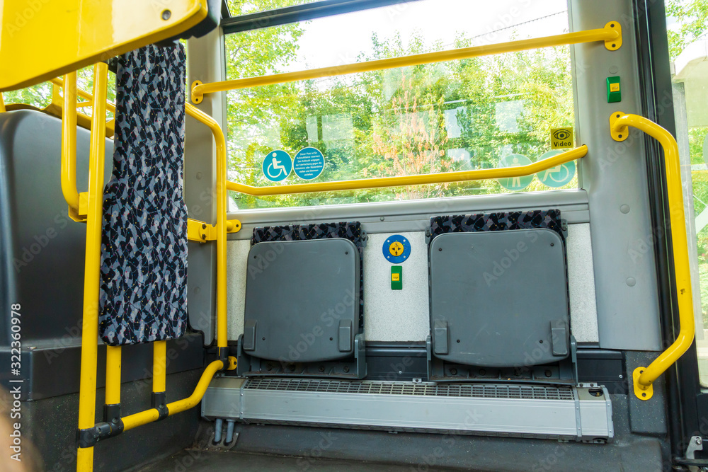 Priority seats. Wheelchair symbol in public transport bus Stock Photo ...