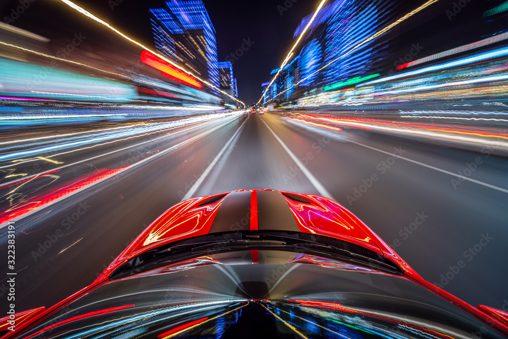 View from roof of the red muscle car Car moving in a night city, Blured ...