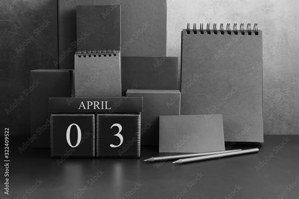 April 3th. Day 3 of month. Wood cube calendar with date month and day ...