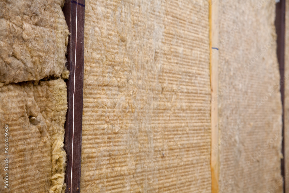 warming the walls of a stone house with a stone wool heater. Ecological ...