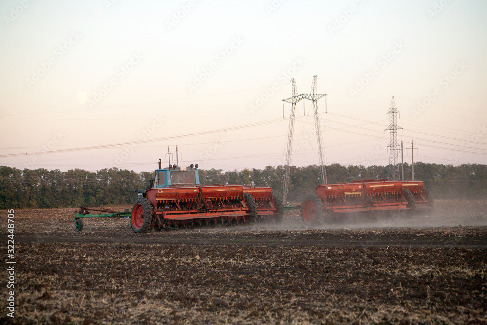 Agricultural mechanical seeders of grain crops. Tactor with a seeder ...