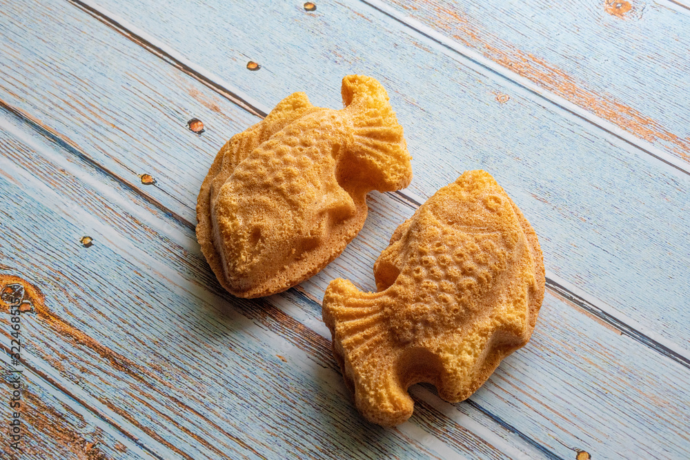 Traditional Malaysian cake called "kuih bahulu or baulu" in fish shape ...
