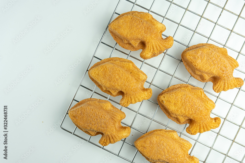 Traditional Malaysian cake called "kuih bahulu or baulu" in fish shape ...